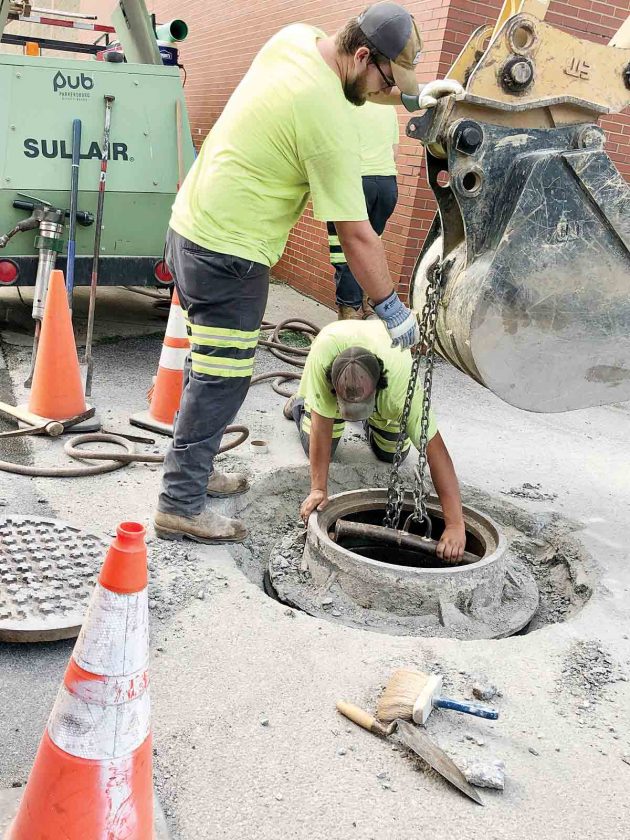 Manhole work | News, Sports, Jobs - News and Sentinel